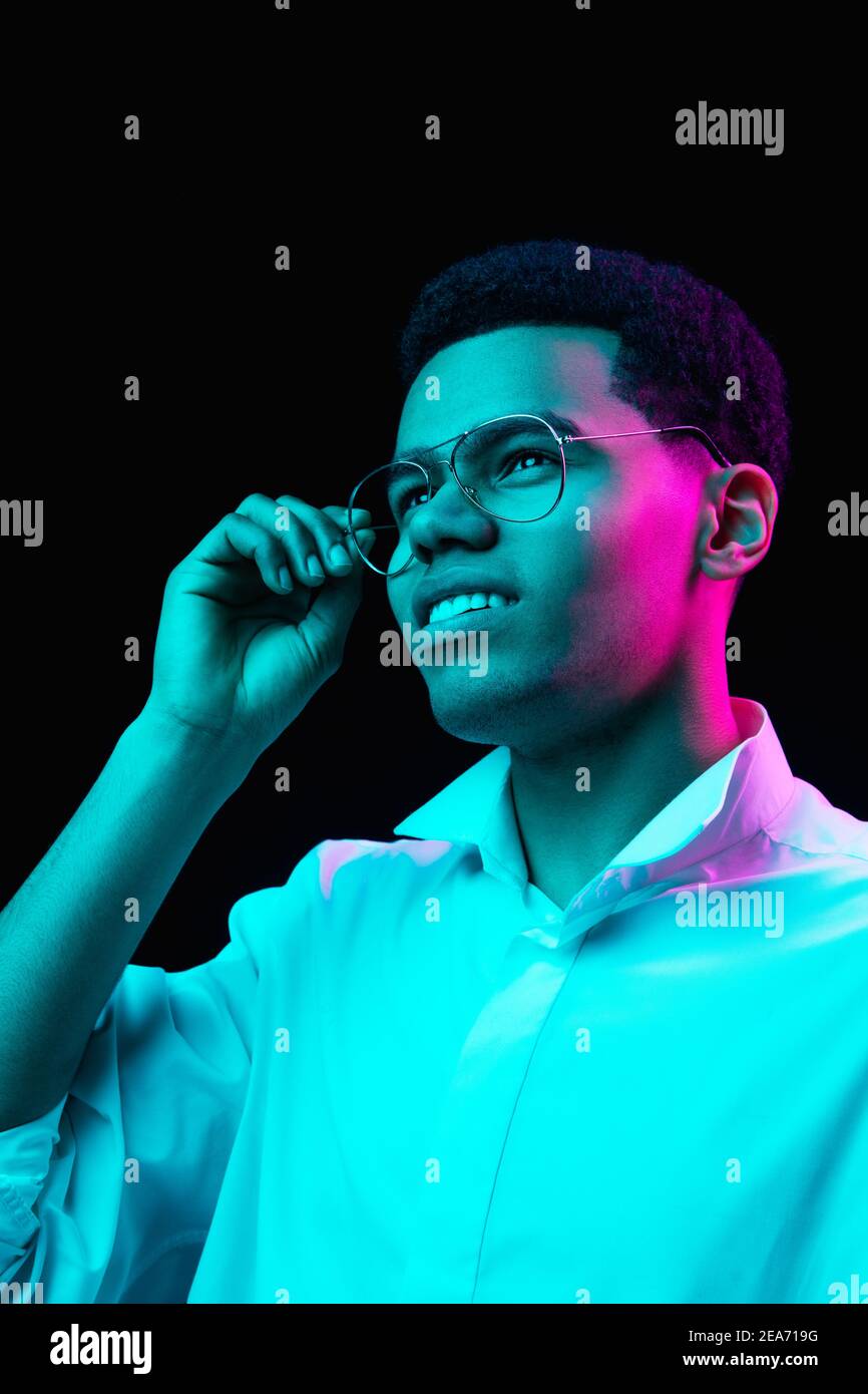 Smart. African-american man's portrait on black studio background in ...