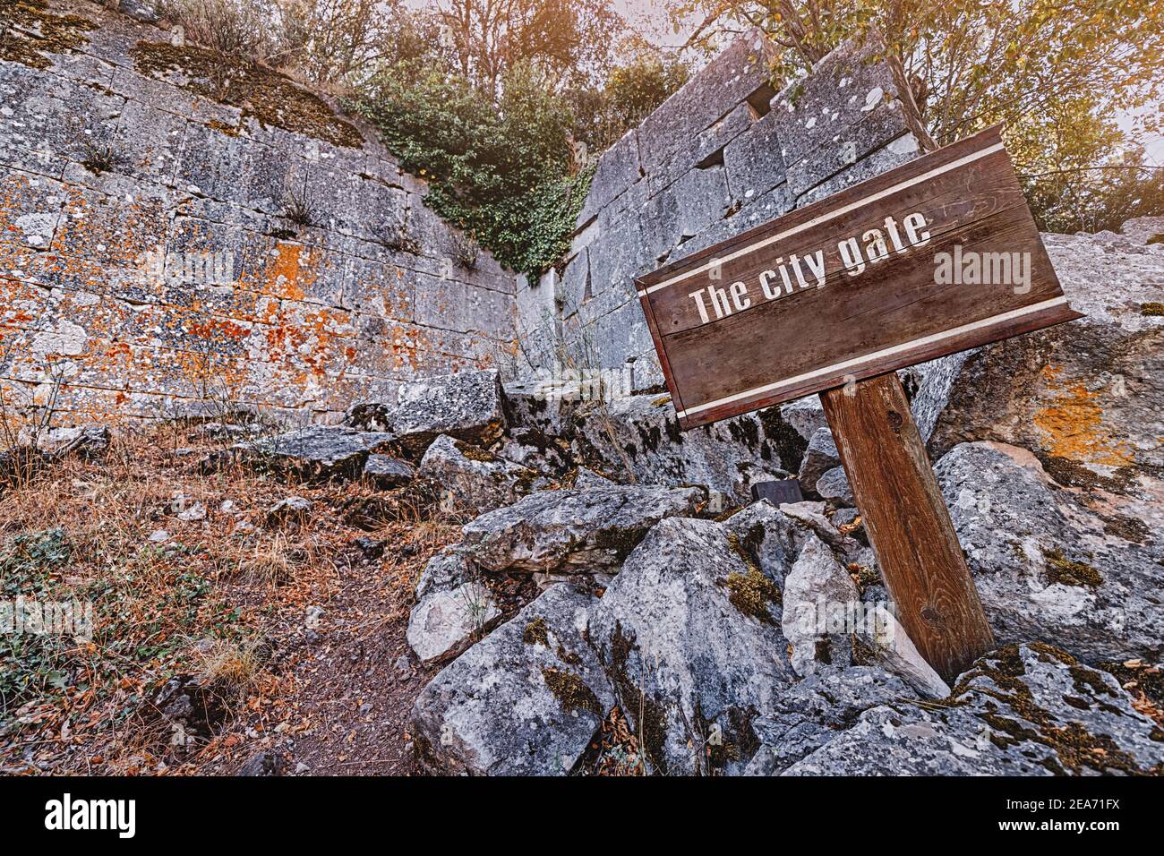 Wooden signpost marking city gate of an ancient city. Travel ...