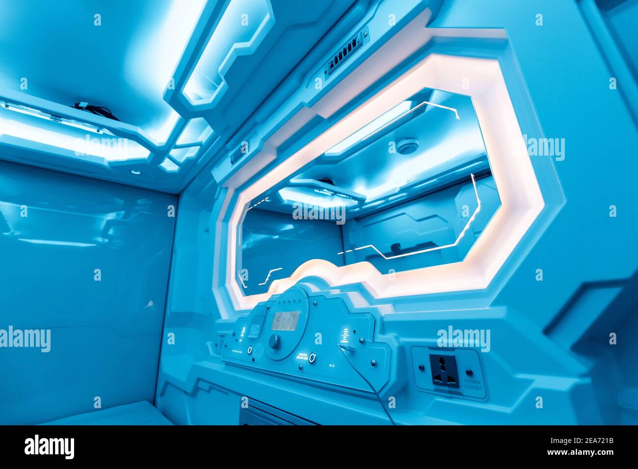 Inside a small cozy room in a capsule hotel - a futuristic interior ...