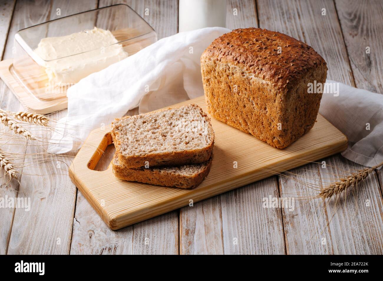 Side view on fresh baked cut whole wheat bread Stock Photo - Alamy