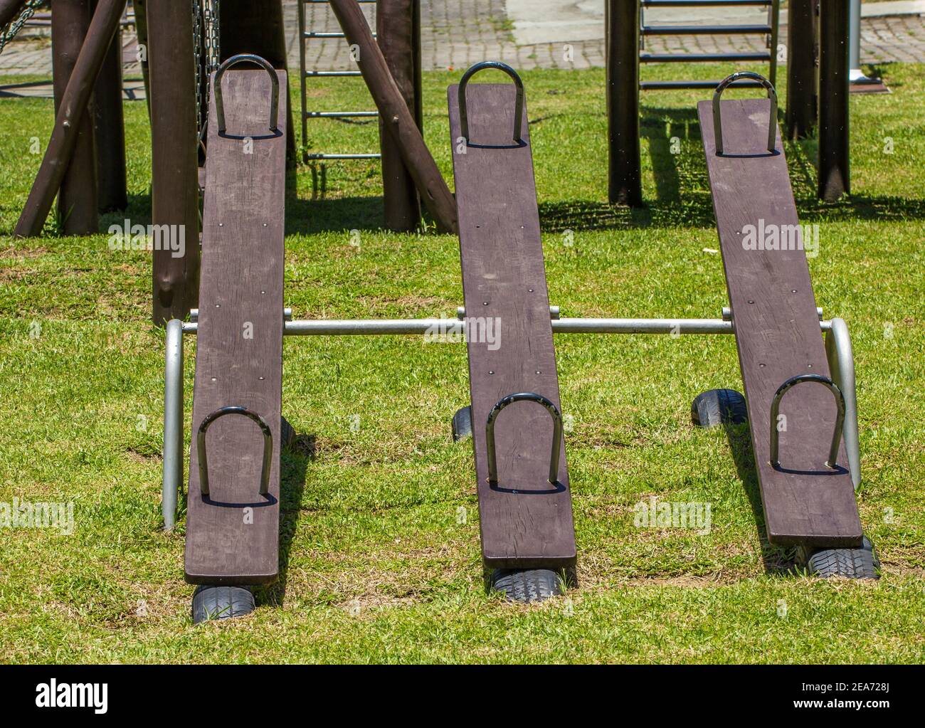Seesaws in a playground in a park at daytime Stock Photo - Alamy