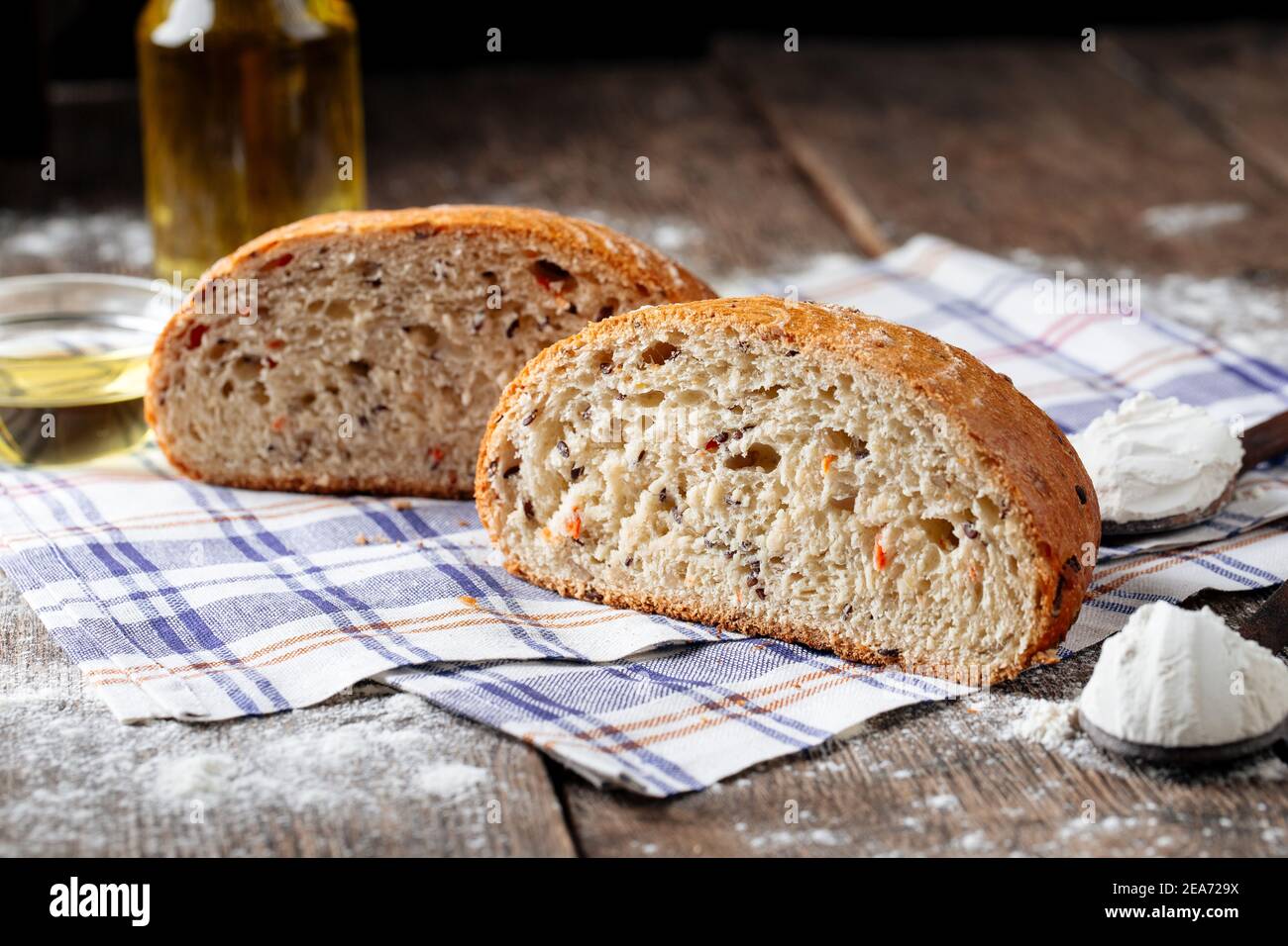 Side view on cut loaf of rustic bread with filling Stock Photo - Alamy