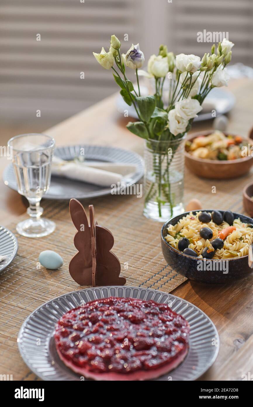 Close up background of elegant Easter dinner table set with Spring ...