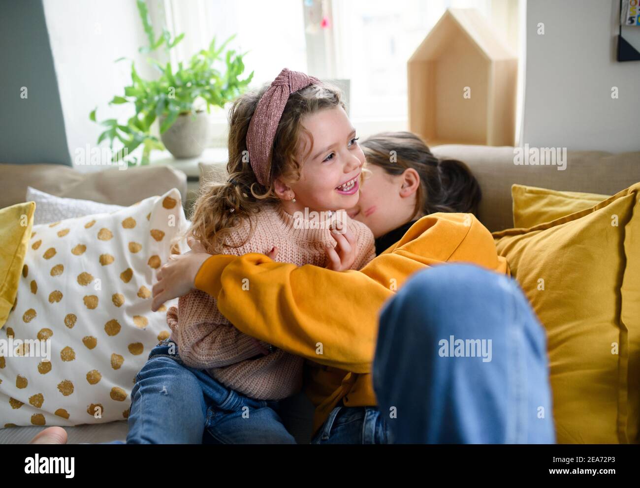 Sisters indoors at home, playing and having fun. Lockdown concept Stock ...
