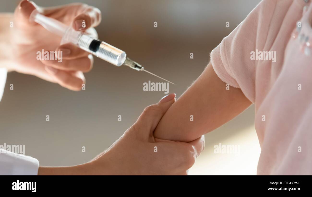 Close up of female nurse make injection to small child Stock Photo - Alamy