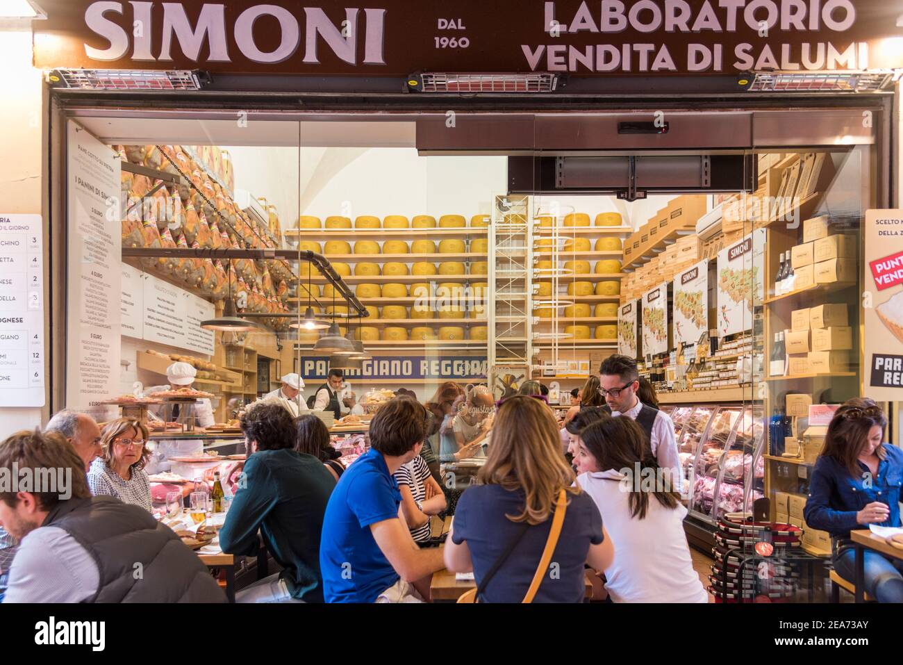 People dining at outside tables at the Simoni Italian delicatessen ...