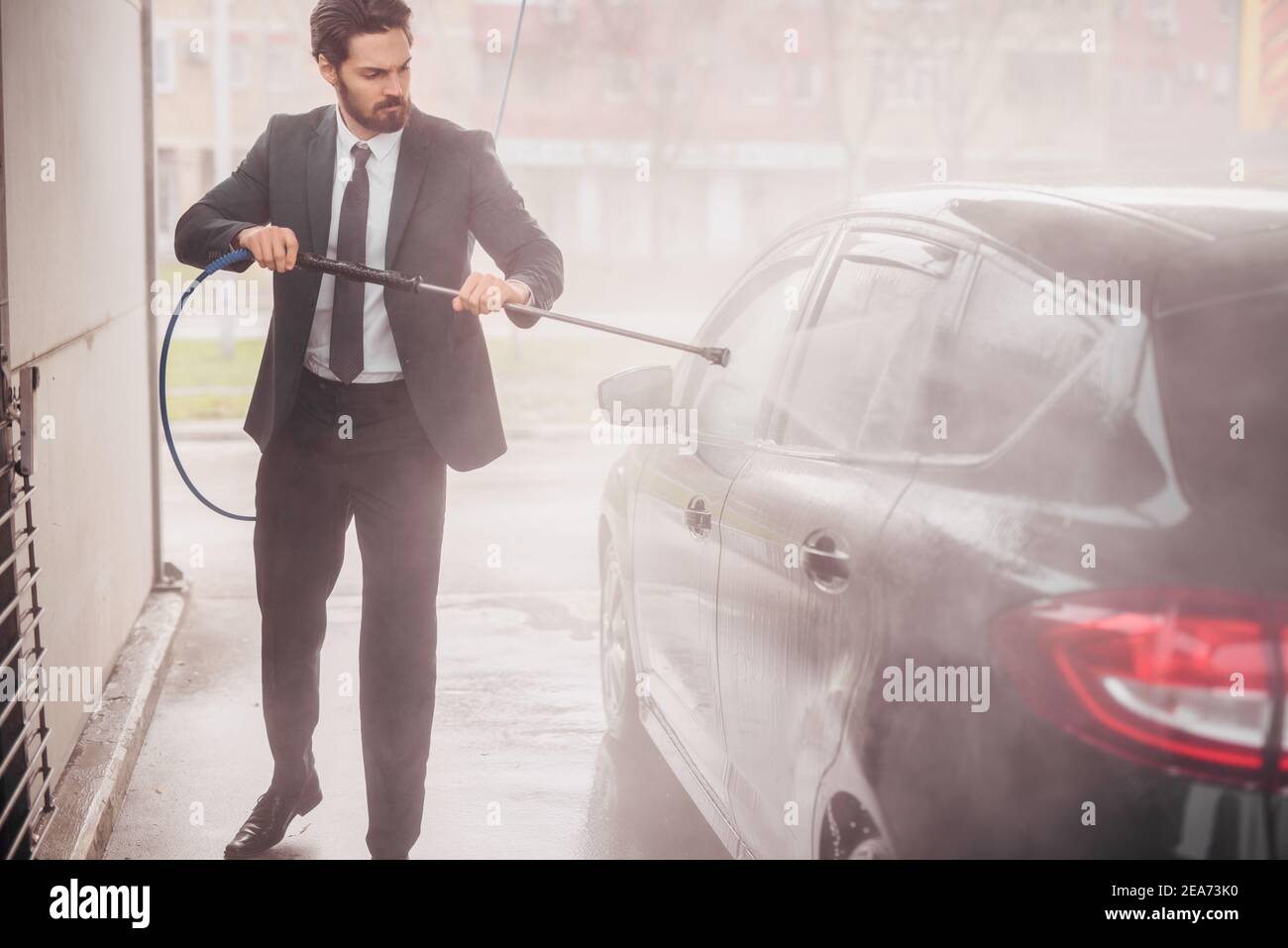Focused washing automobile man hi-res stock photography and images - Alamy