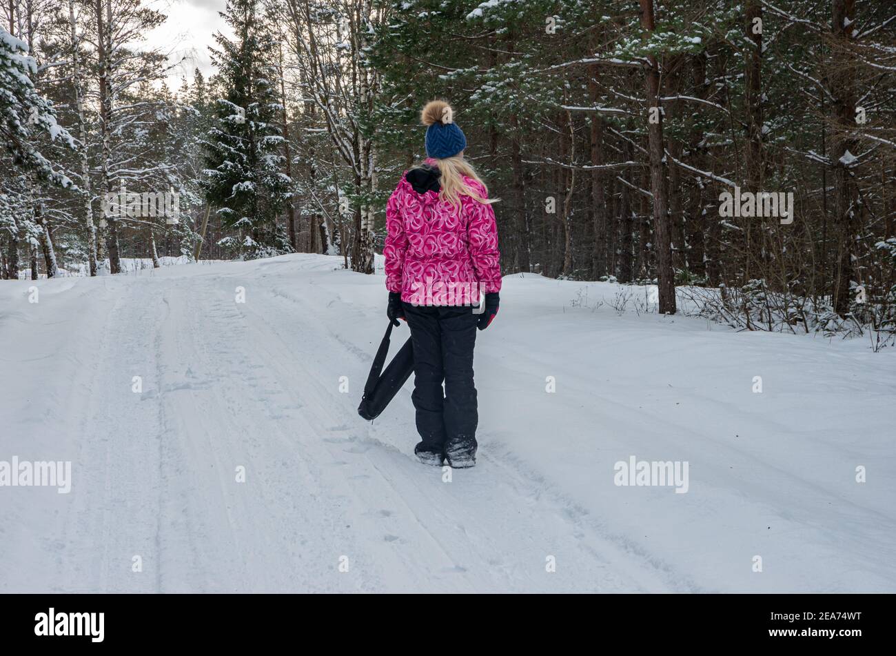 Blonde girl in the forest in winter with a lot of snow, in the forest ...