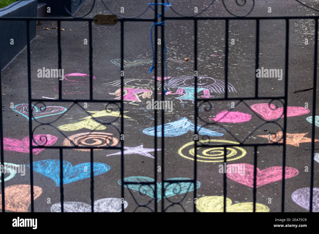 Drawings with colorful chalk on the ground Stock Photo - Alamy