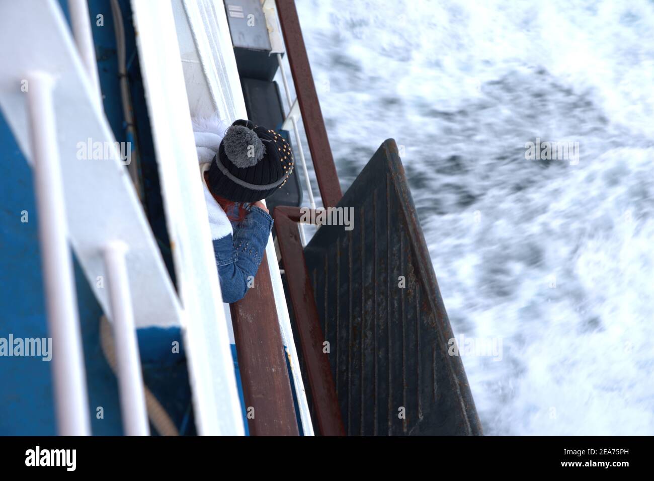Kid enjoying the view of the sea from a boat Stock Photo - Alamy