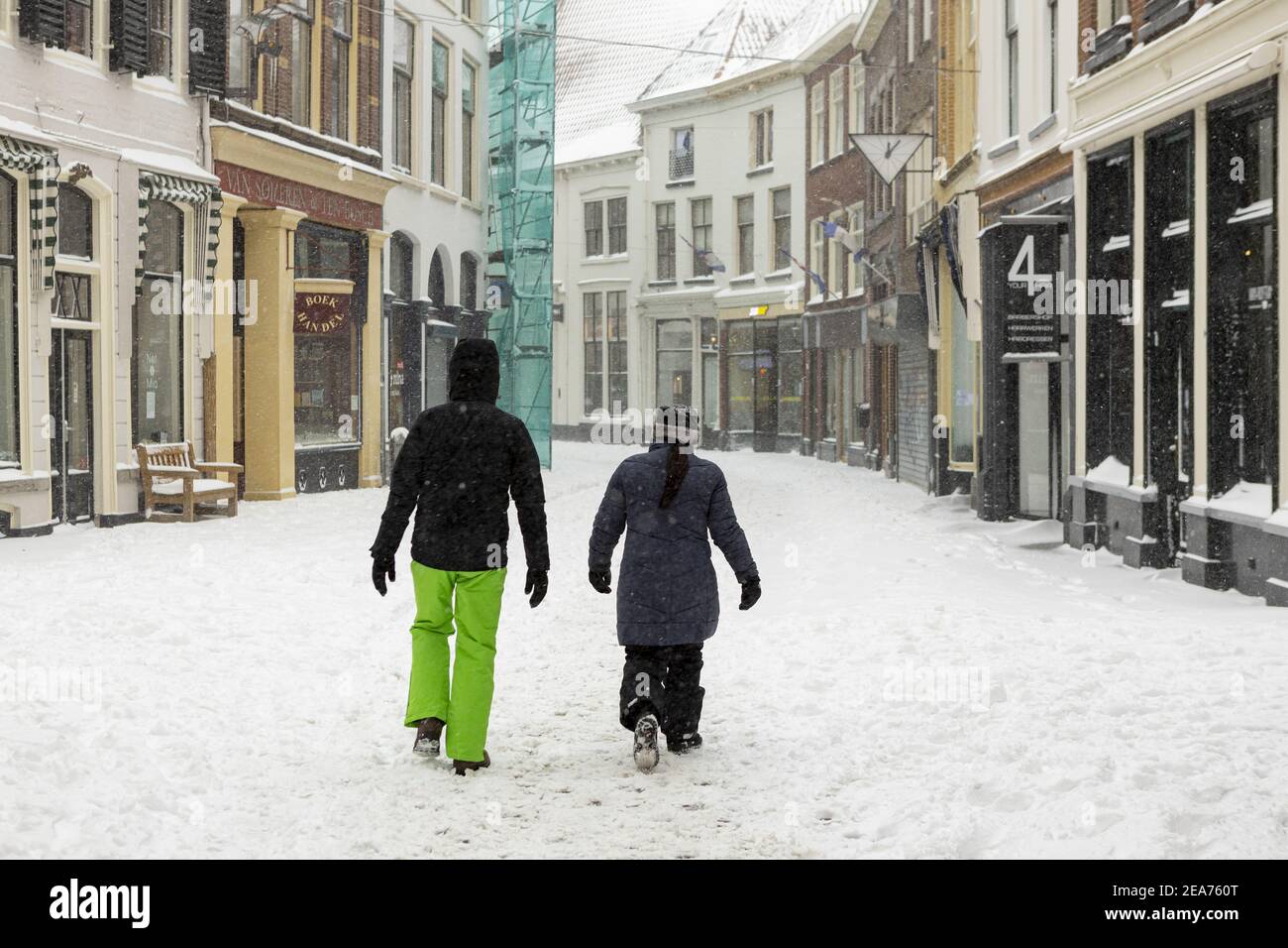 ZUTPHEN, NETHERLANDS - Feb 07, 2021: Couple walking in the streets of ...
