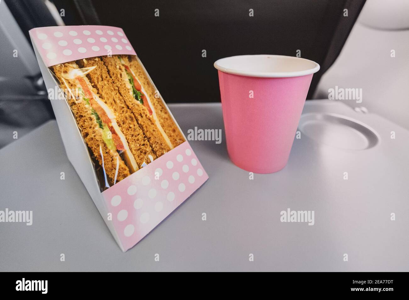 Economical Breakfast on a spread out table inside the airplane during ...