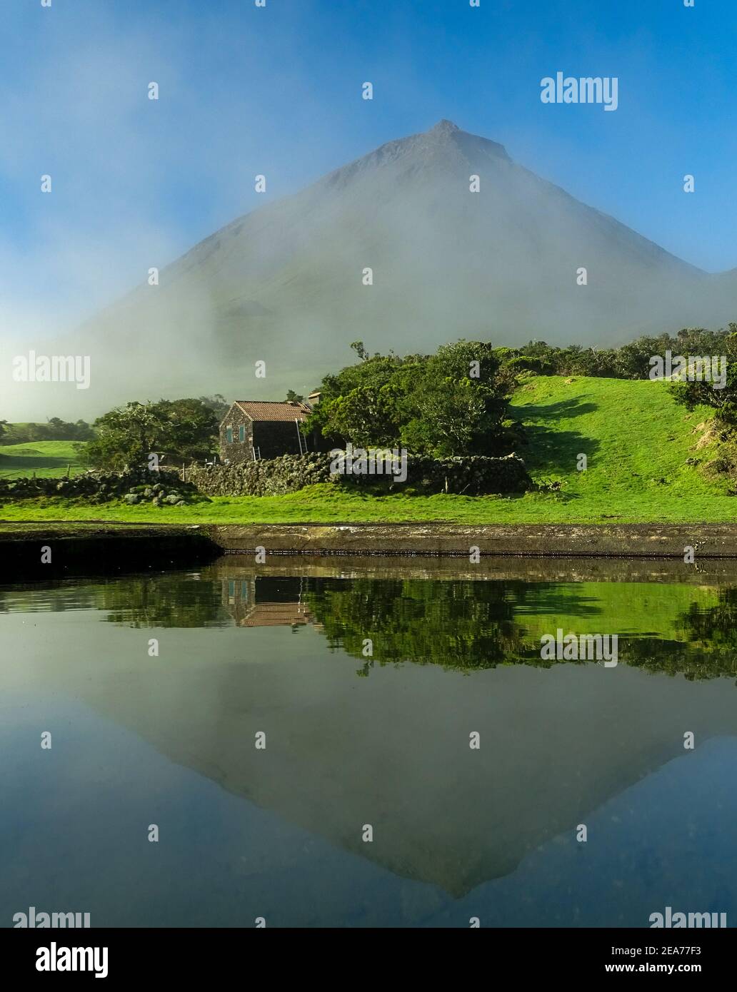 Pico mountain at Pico island, Azores landscape, reflection in water ...