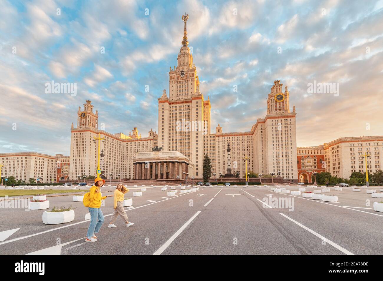 Two female friends students on the background of the building of Moscow ...