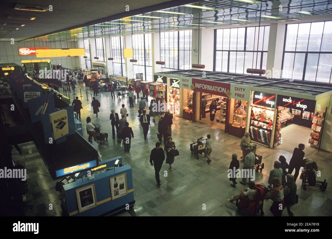 Airline passengers checking in area, Heathrow Airport, 1980s Stock ...