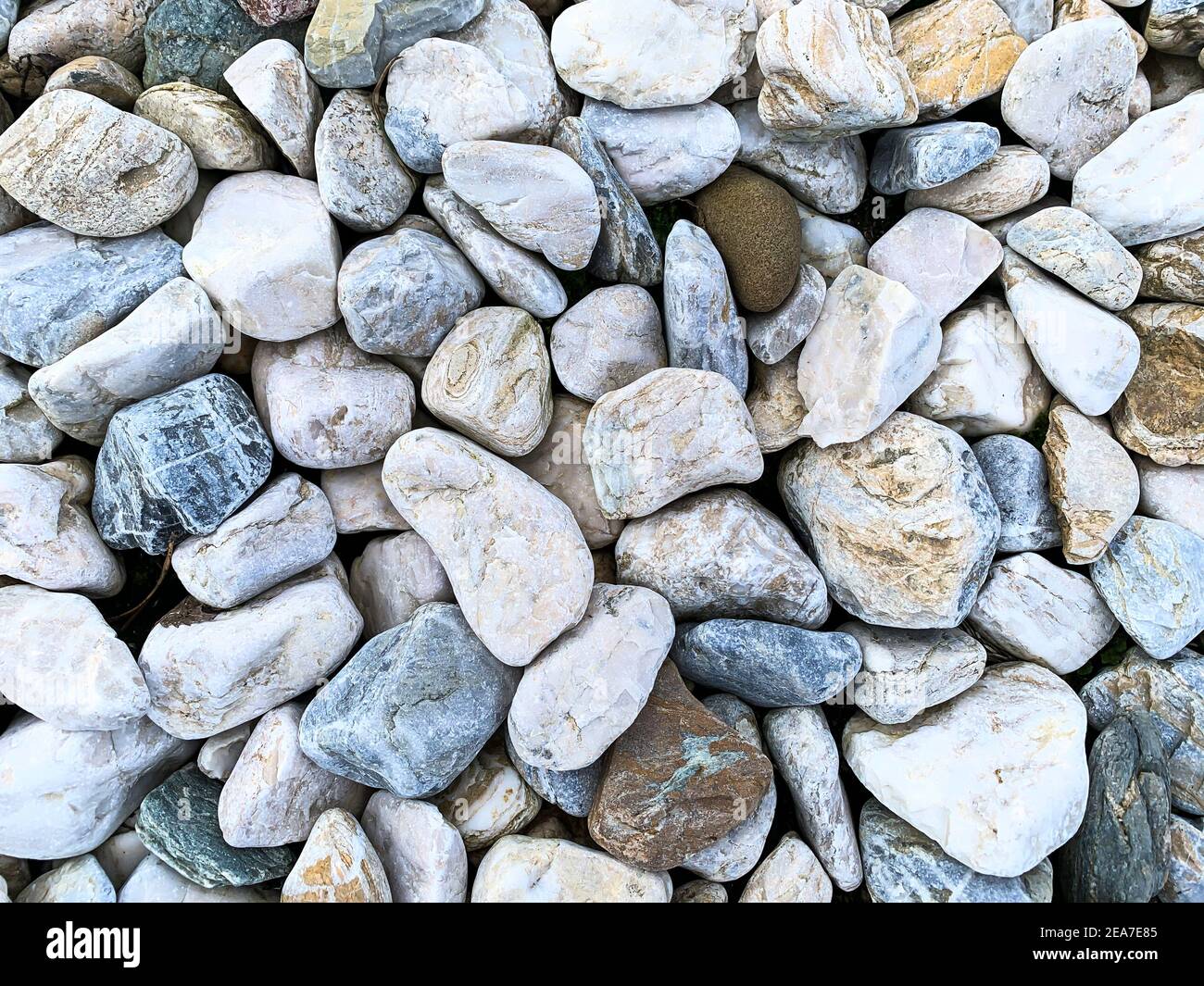 Background from multi-colored stones of different shapes Stock Photo ...