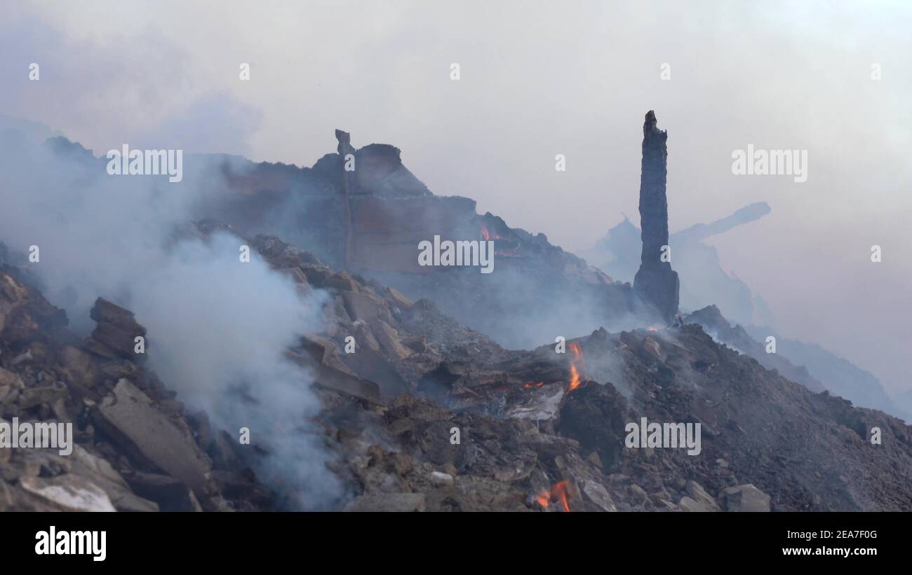 The House Burned Down. Smoking, Blackened Rubble of Structure that has ...