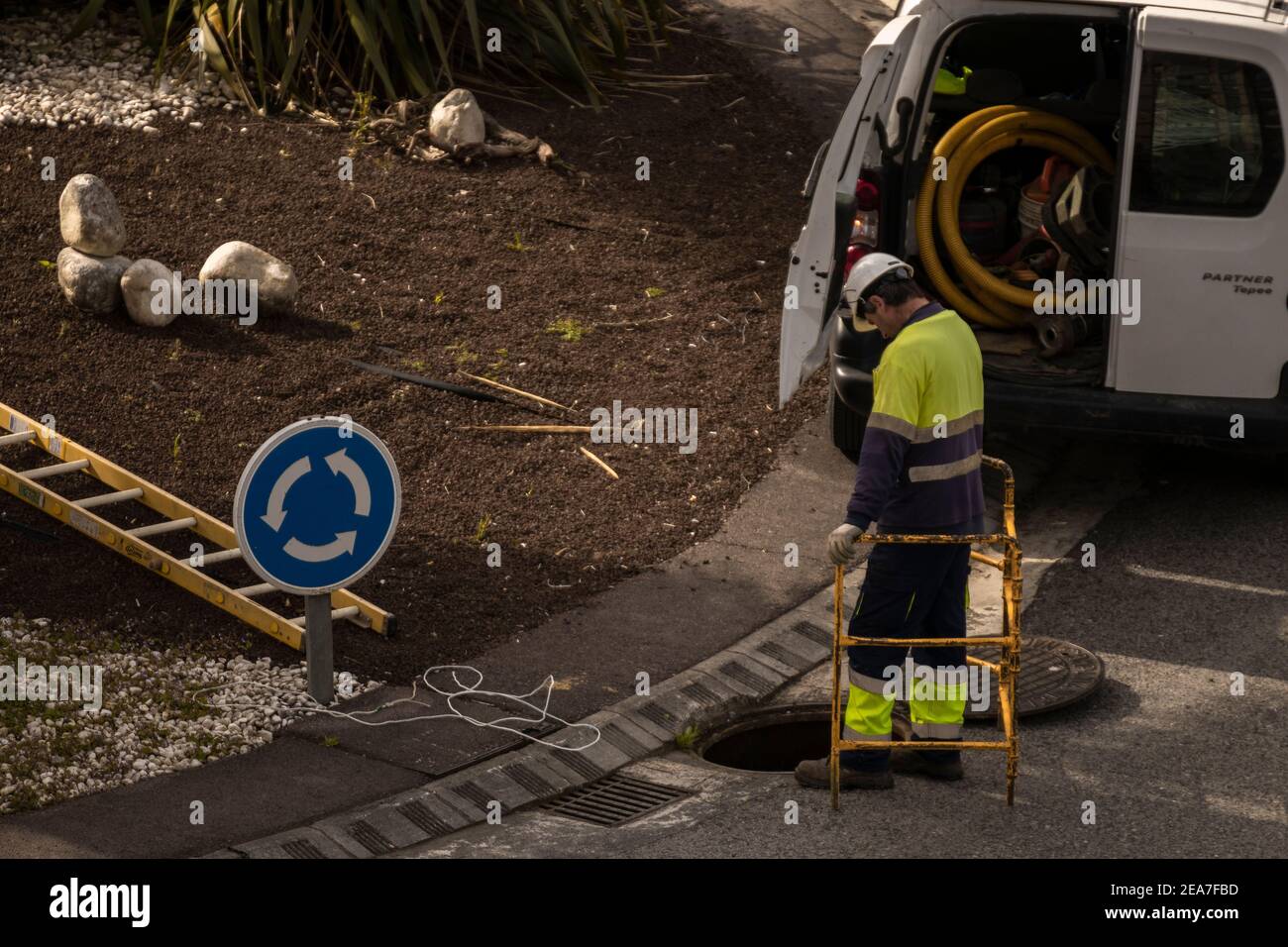 man at work in a road Stock Photo - Alamy