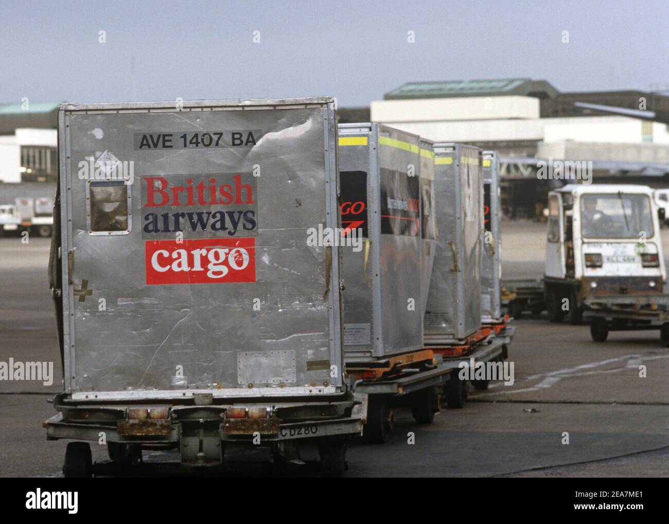 British Airways Jumbo jet luggage pods at Heathrow Airport airside ...