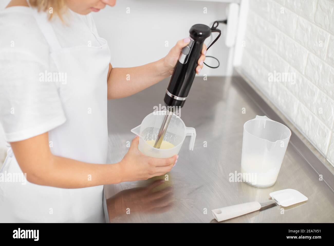 Woman in kitchen whipping cream hi-res stock photography and images - Alamy