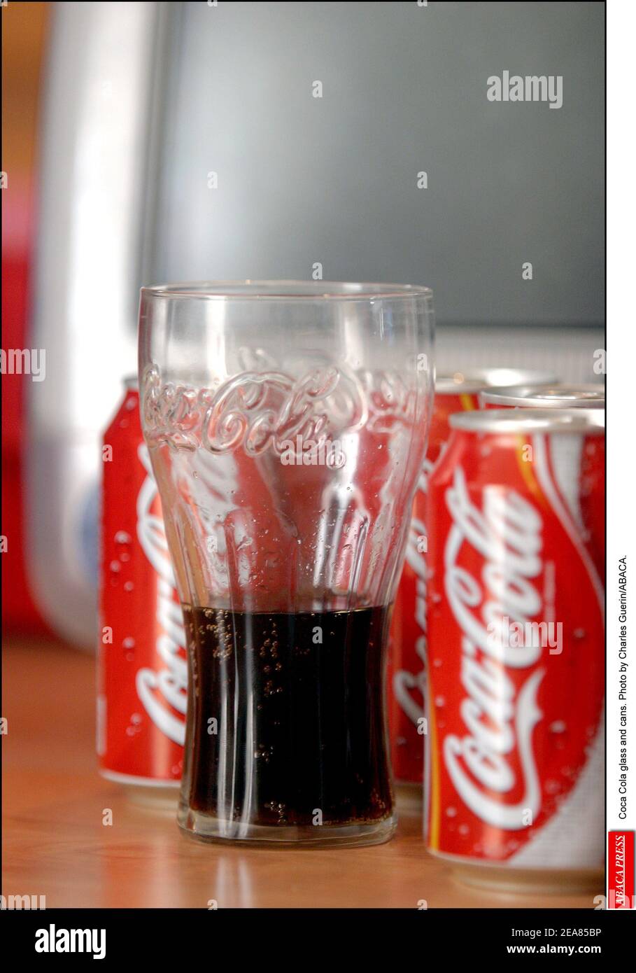 Coca Cola glass and cans. Photo by Charles Guerin/ABACA Stock Photo - Alamy