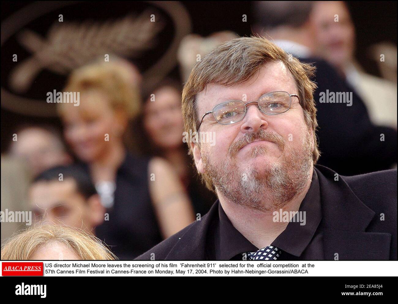 US director Michael Moore leaves the screening of his film 'Fahrenheit ...