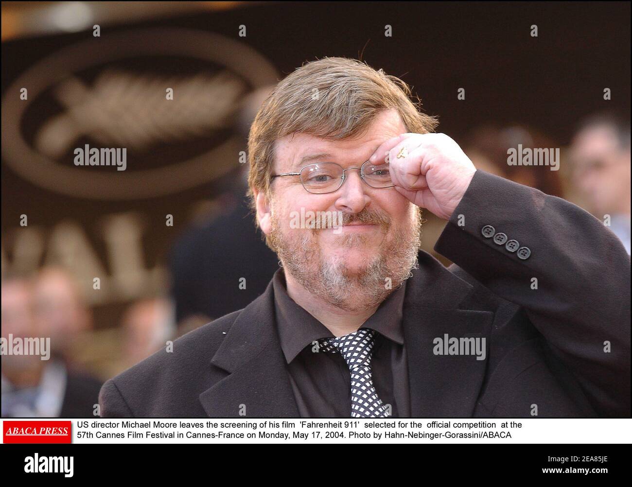 US director Michael Moore leaves the screening of his film 'Fahrenheit ...