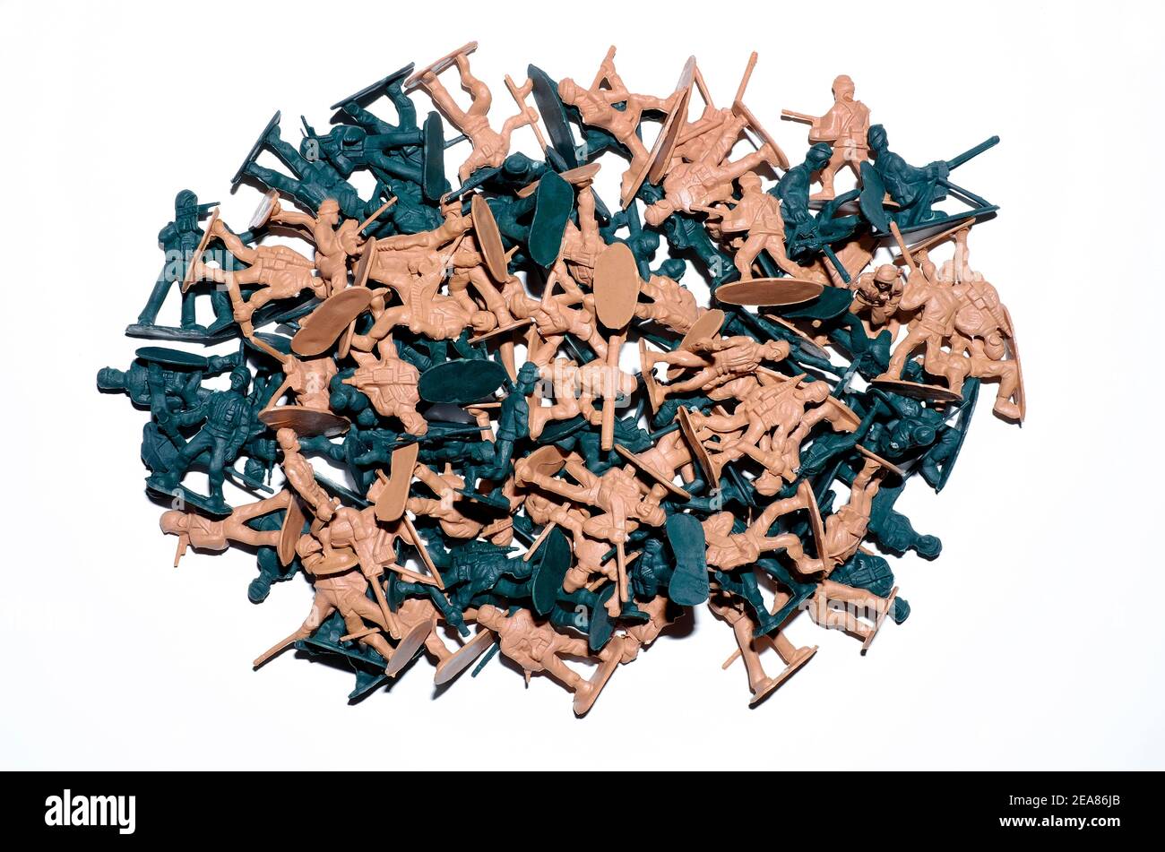 green and brown miniature toy soldiers on white background Stock Photo ...