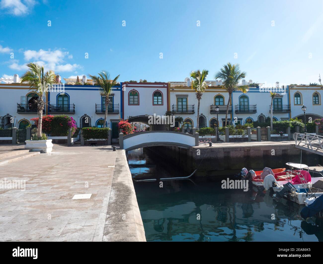 Colorful buildings of Puerto de Mogan with sea canals and boats ...