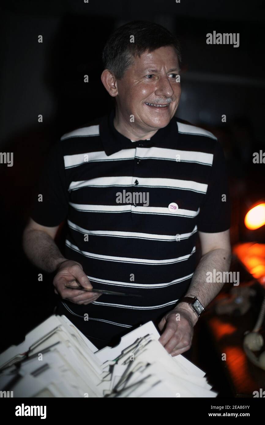 Smiling DJ playing vinyl records in club , London , Uk Stock Photo - Alamy