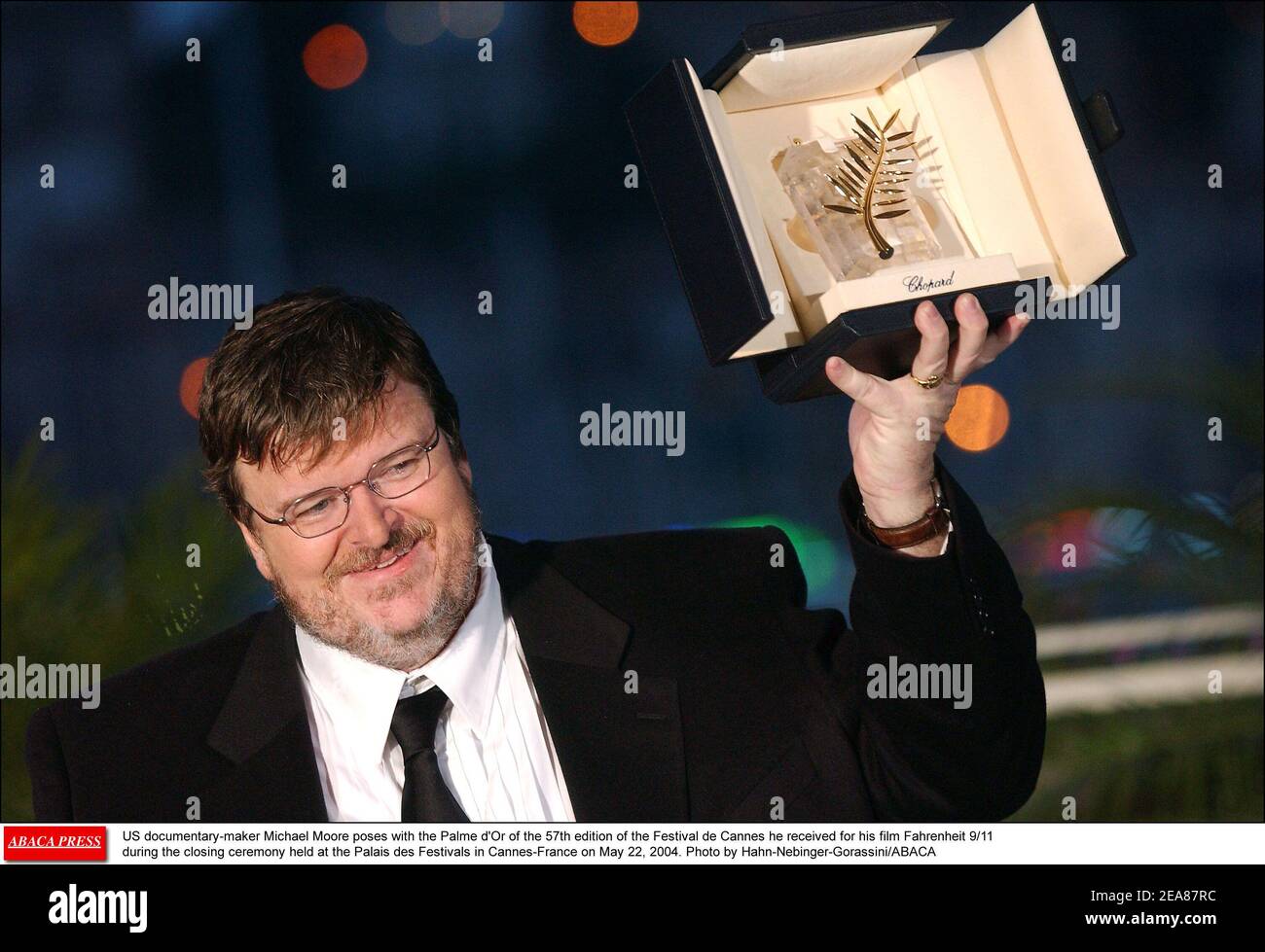 US documentary-maker Michael Moore poses with the Palme d'Or of the ...