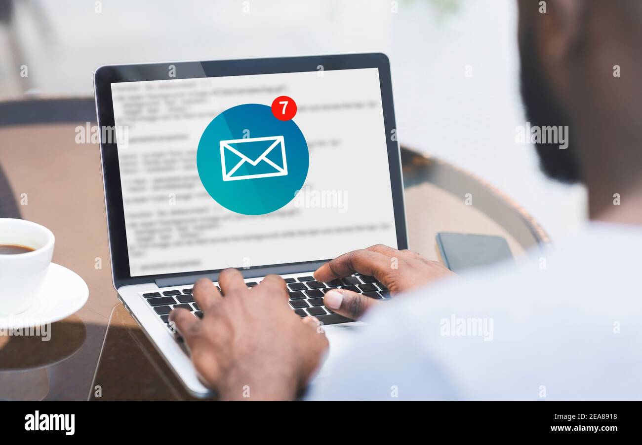 African Man Reading Email Messages On Laptop At Cafe, Cropped Stock ...