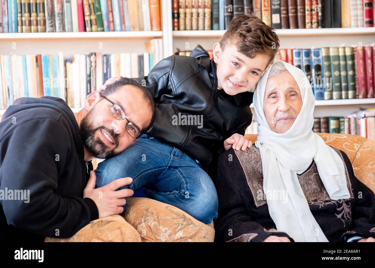 Family enjoy the eid celebration and serving guests Stock Photo - Alamy
