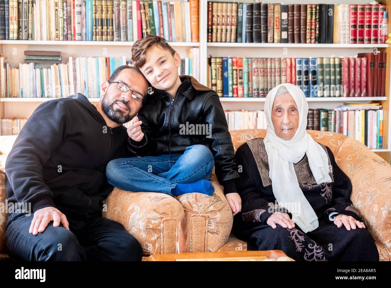 Family enjoy the eid celebration and serving guests Stock Photo - Alamy