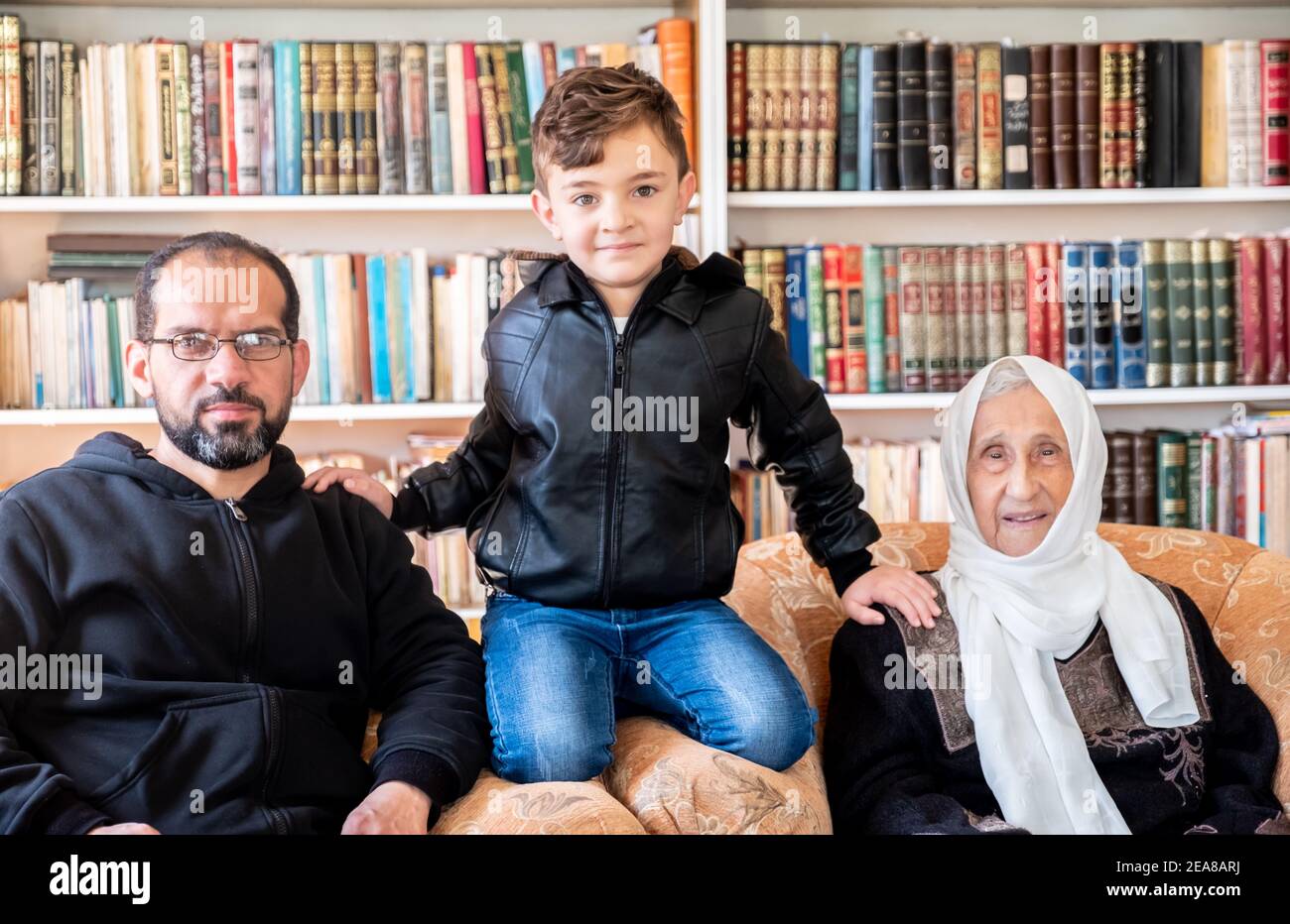 Family enjoy the eid celebration and serving guests Stock Photo - Alamy