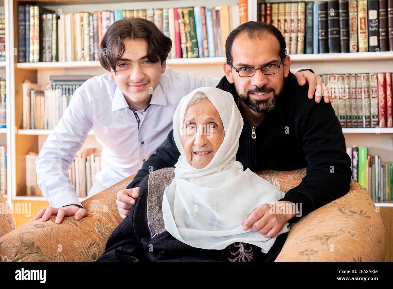Family enjoy the eid celebration and serving guests Stock Photo - Alamy