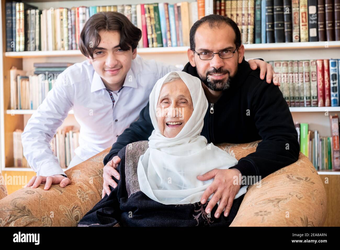 Family enjoy the eid celebration and serving guests Stock Photo - Alamy