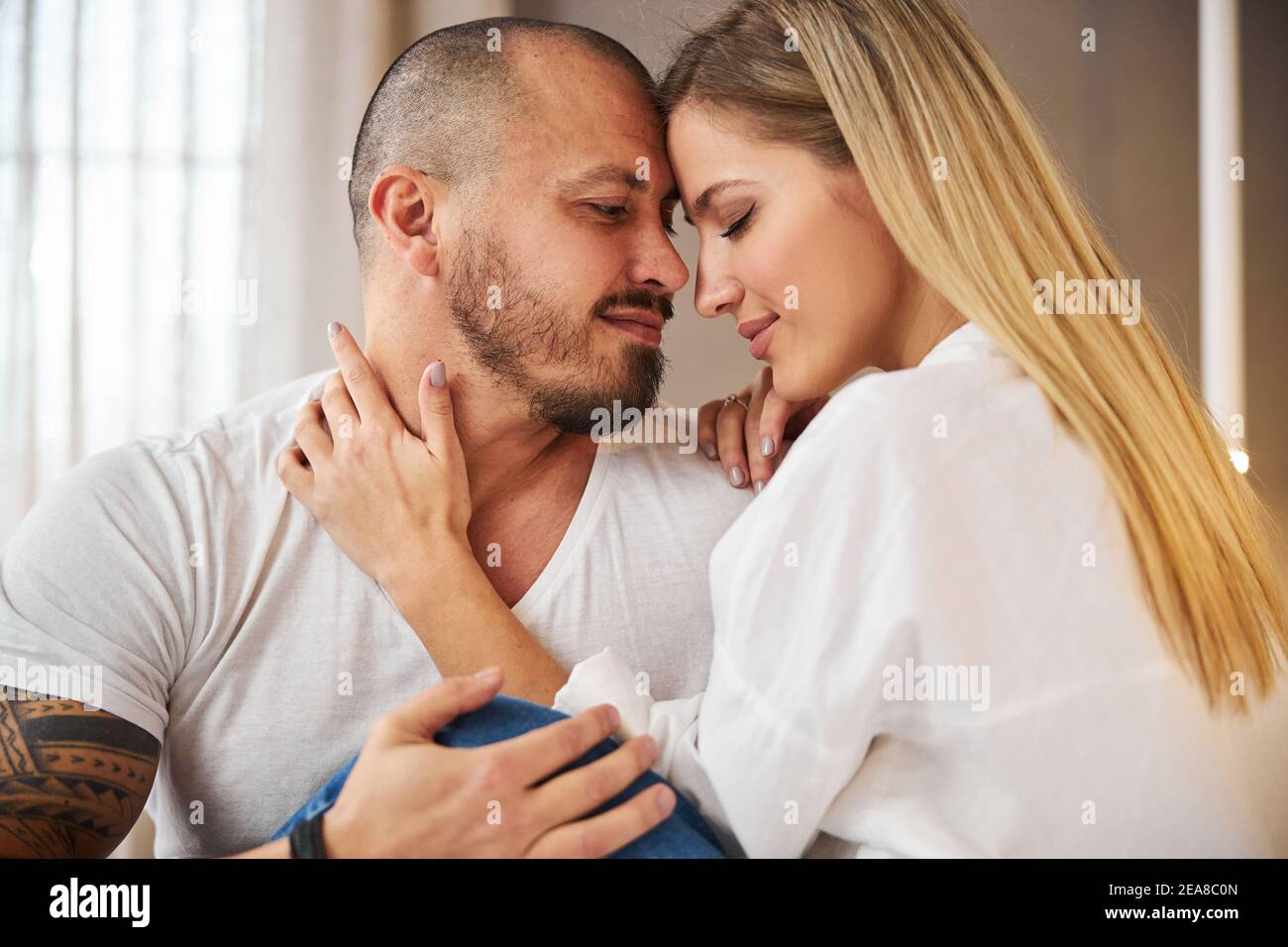 Man and his wife feeling deeply connected Stock Photo - Alamy
