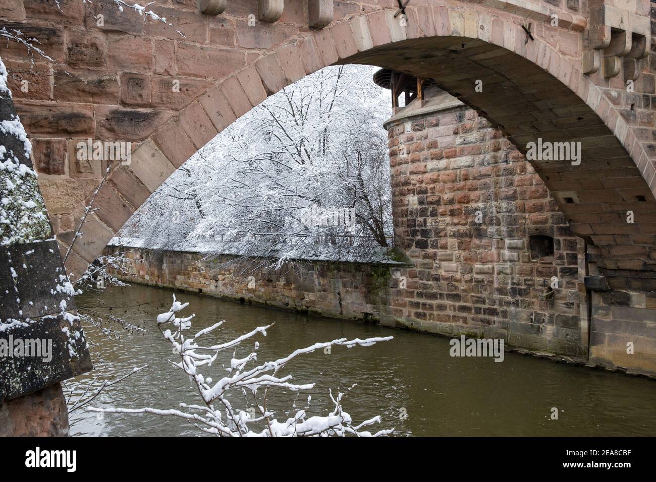 08 February 2021, Bavaria, Nuremberg: View under an arch of the old ...