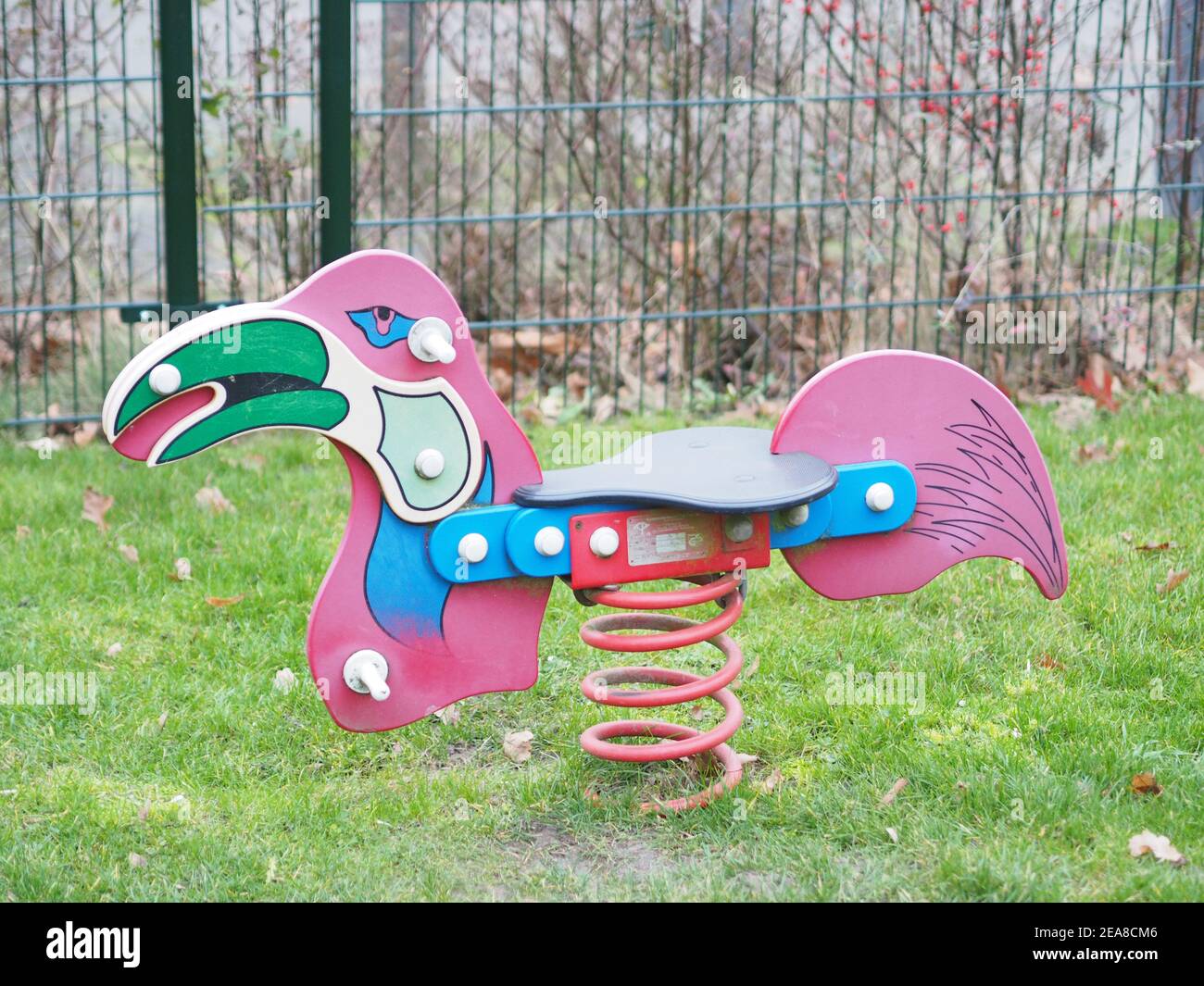 Flamingo shaped rocking chair on playground Stock Photo - Alamy