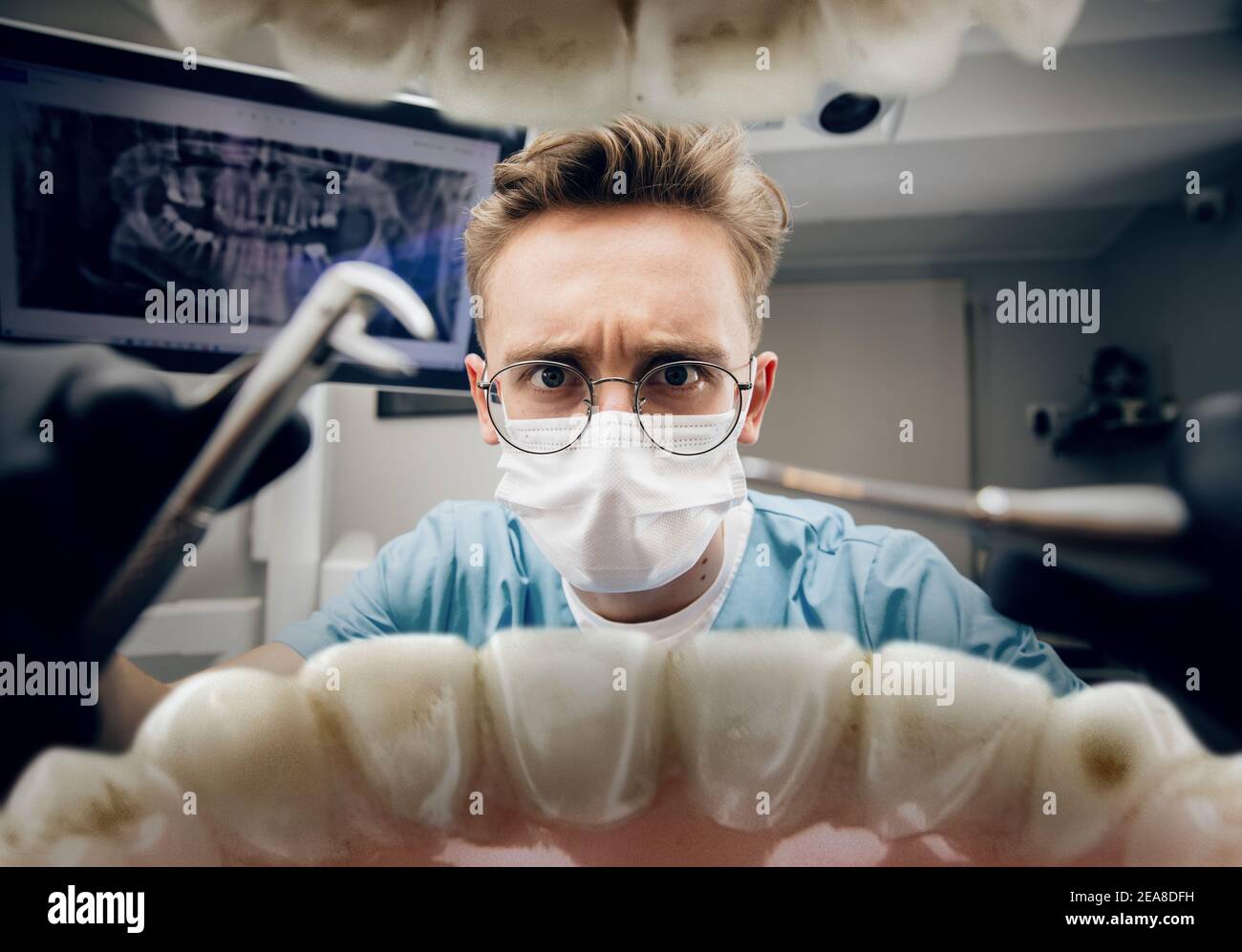 Attented. Doctor looking into mouth, checking, examining teeth. Using ...