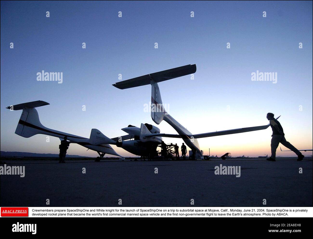 Crewmembers prepare SpaceShipOne and White knight for the launch of ...