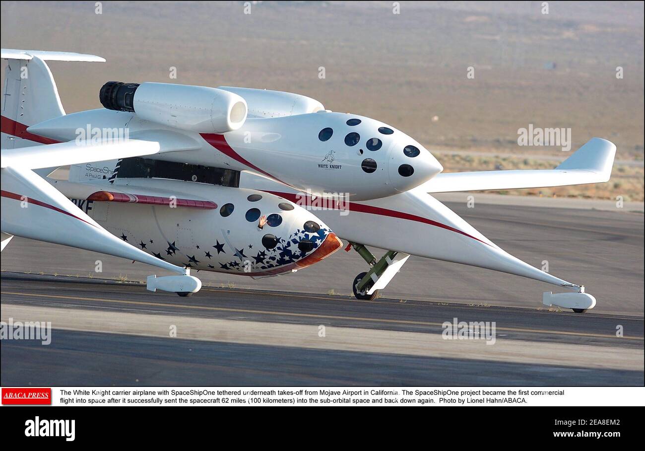 The White Knight carrier airplane with SpaceShipOne tethered underneath ...