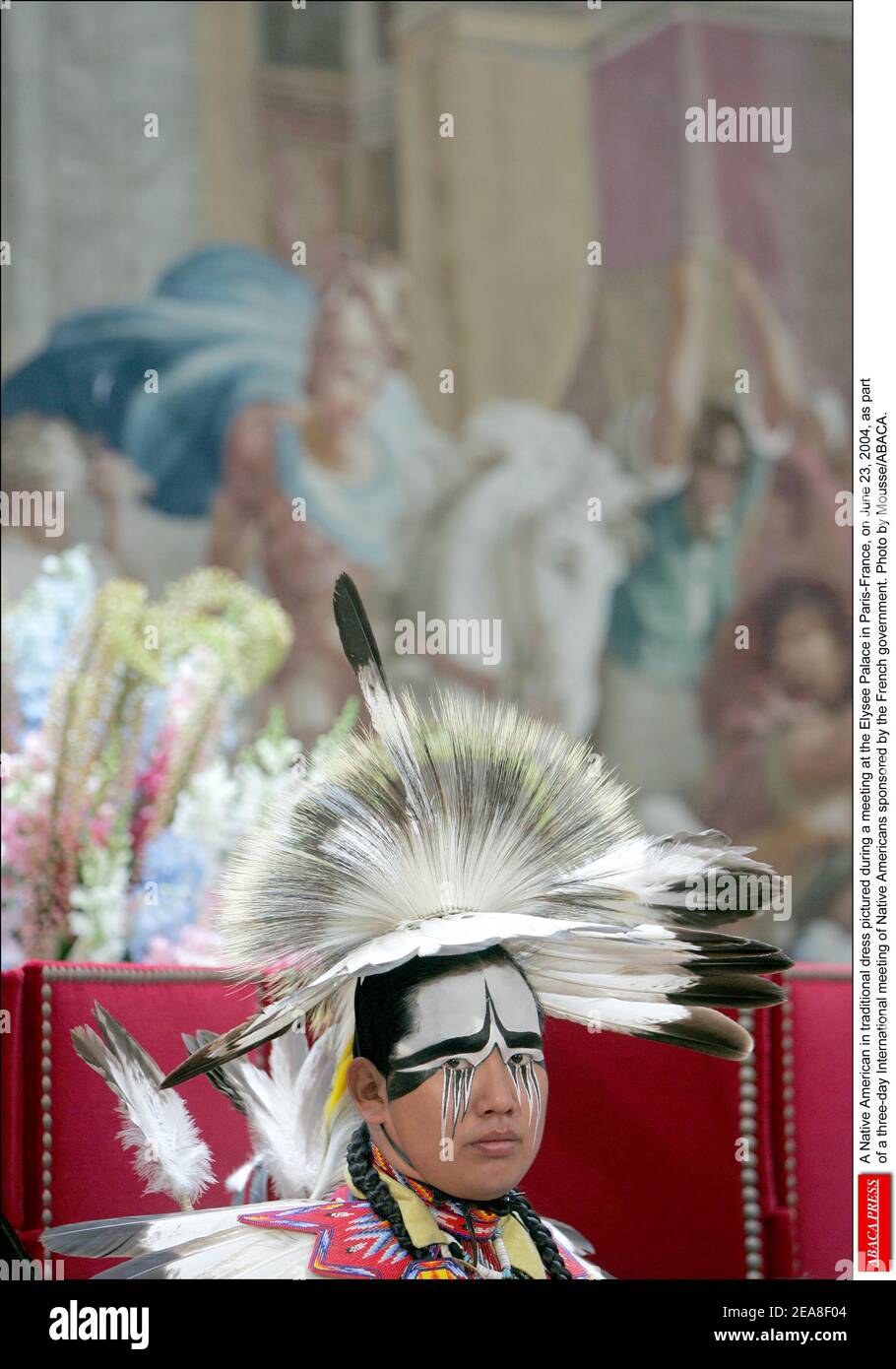 A Native American in traditional dress pictured during a meeting at the ...