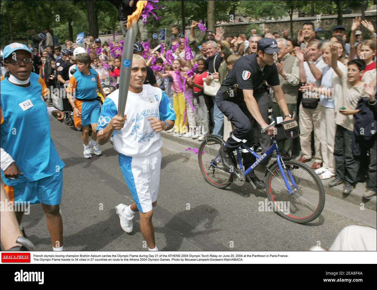 French olympic boxing champion Brahim Asloum carries the Olympic Flame ...