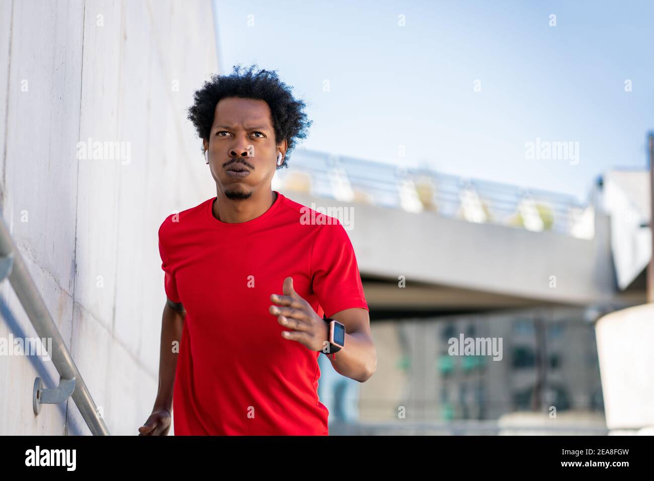 Athletic man running and doing exercise outdoors Stock Photo - Alamy