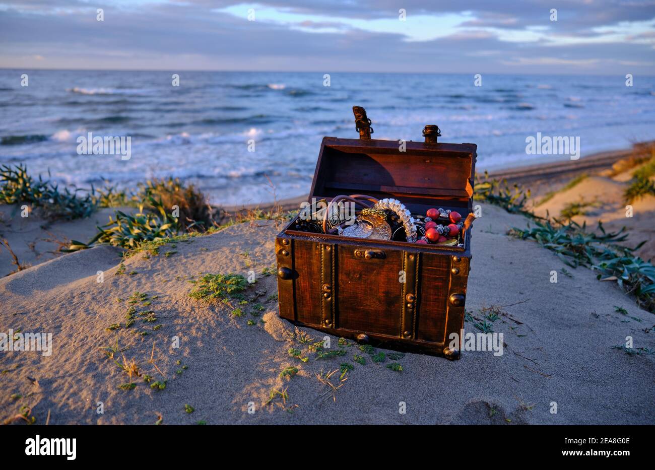 treasure chest at the beach in a sunrise, jewels and gold coins Stock ...