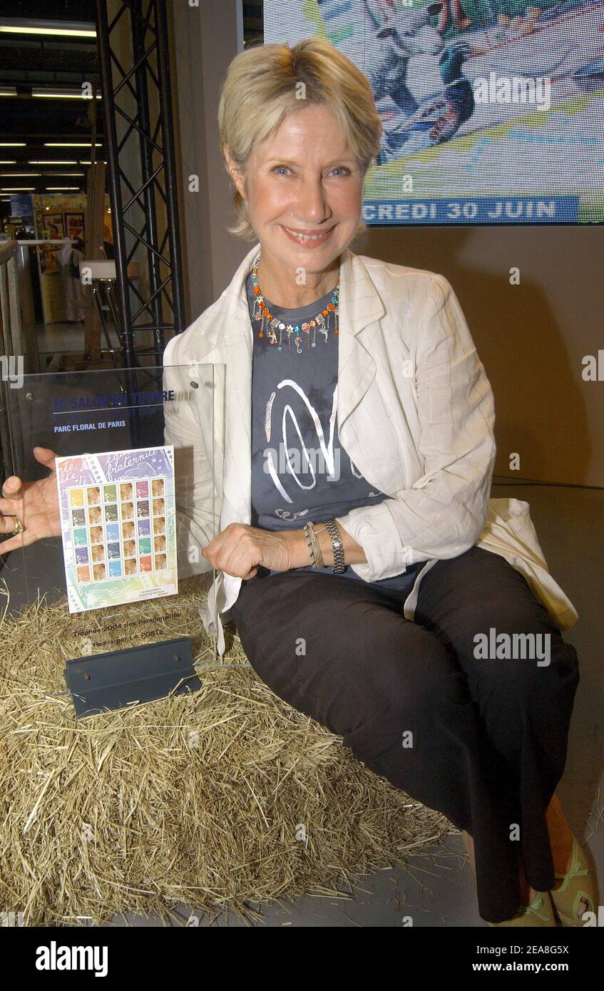 Prior to receive a stamp with her portrait, French TV anchor Daniele ...