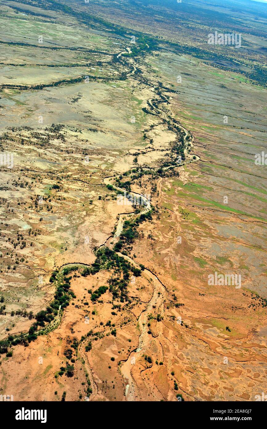 Australia, NT, aerial view over outback landscape with dry river bed ...