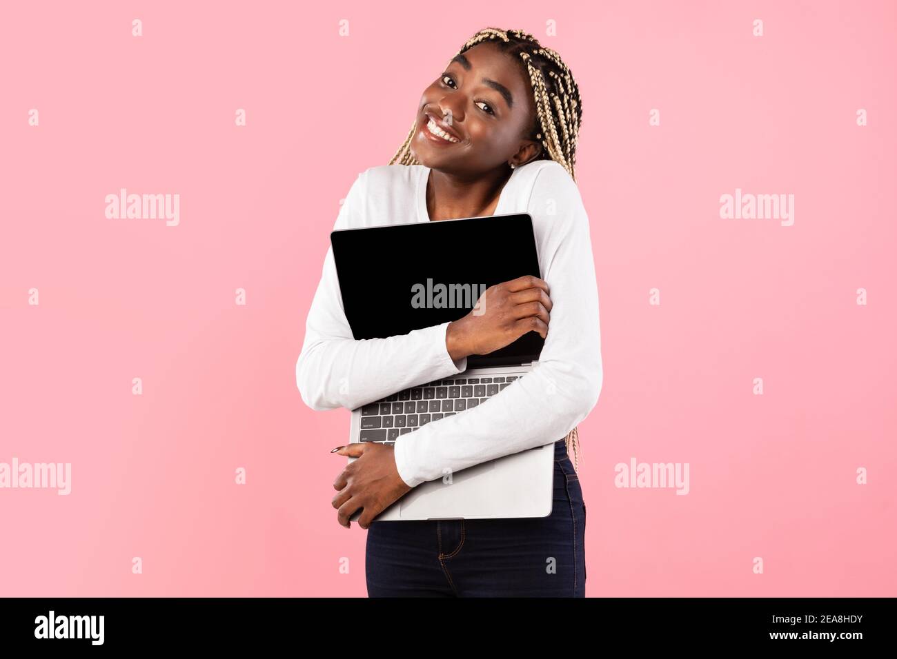 Technology Lover. Excite black woman hugging personal computer Stock ...
